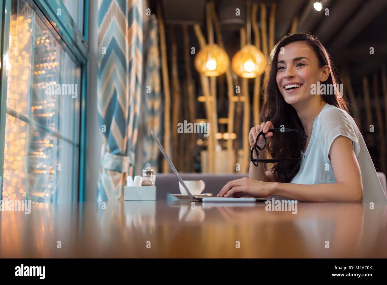 Happy female freelancer involving on project Stock Photo - Alamy