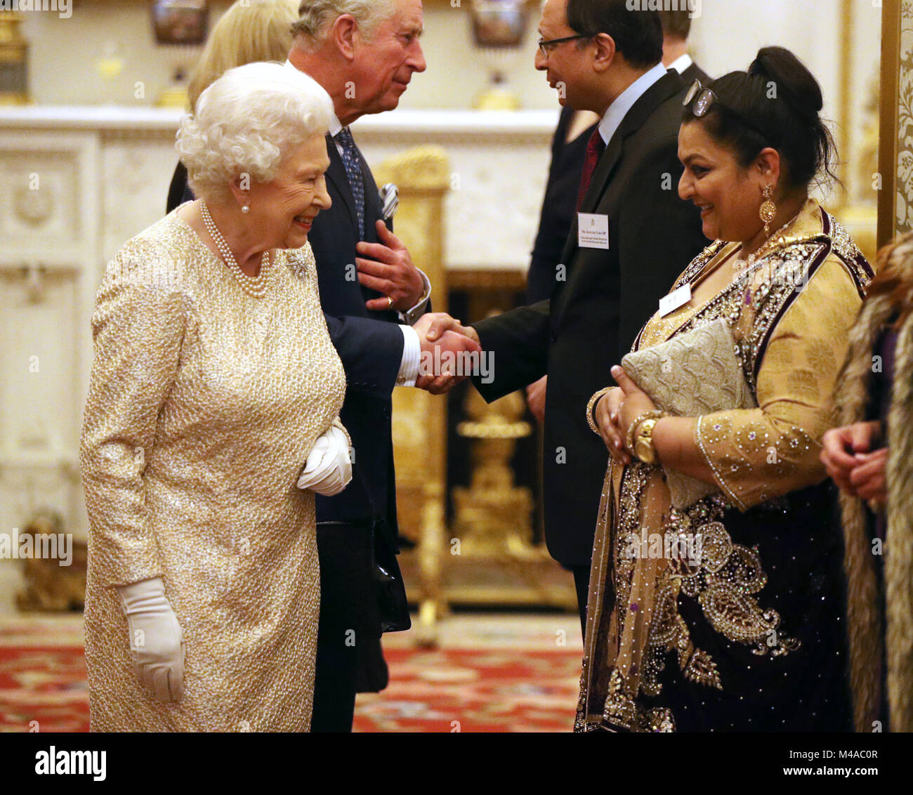 Queen Elizabeth II talks to Saj Ghafoor at a reception to celebrate the ...