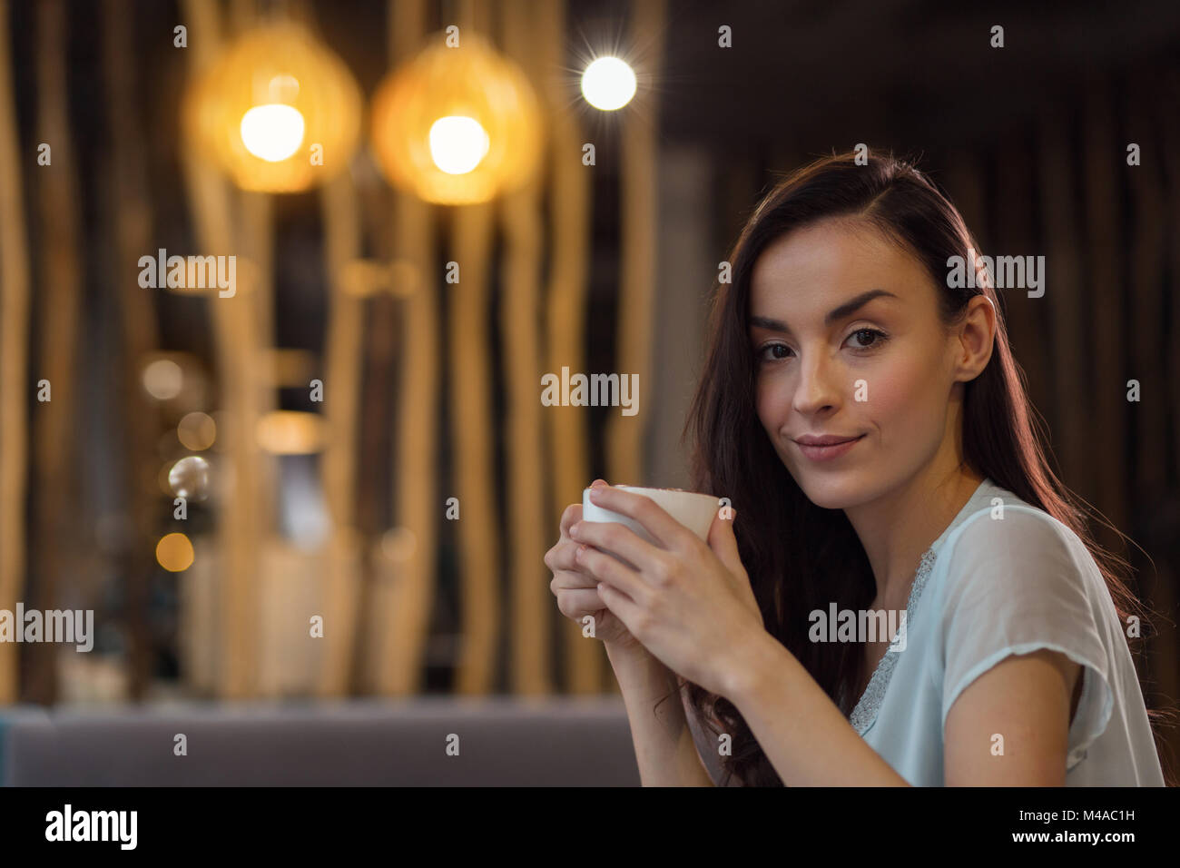 Beautiful irresistible woman asking question Stock Photo - Alamy