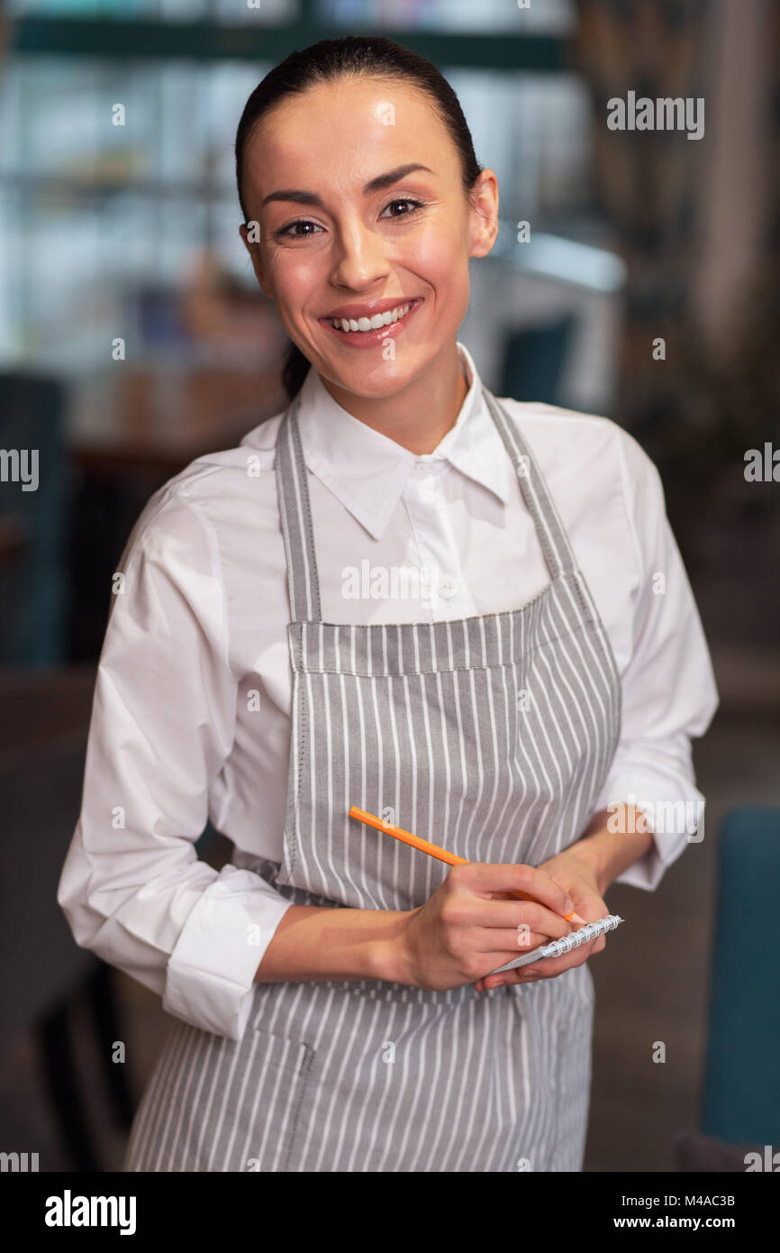 Professional pretty waitress listening to your order Stock Photo - Alamy
