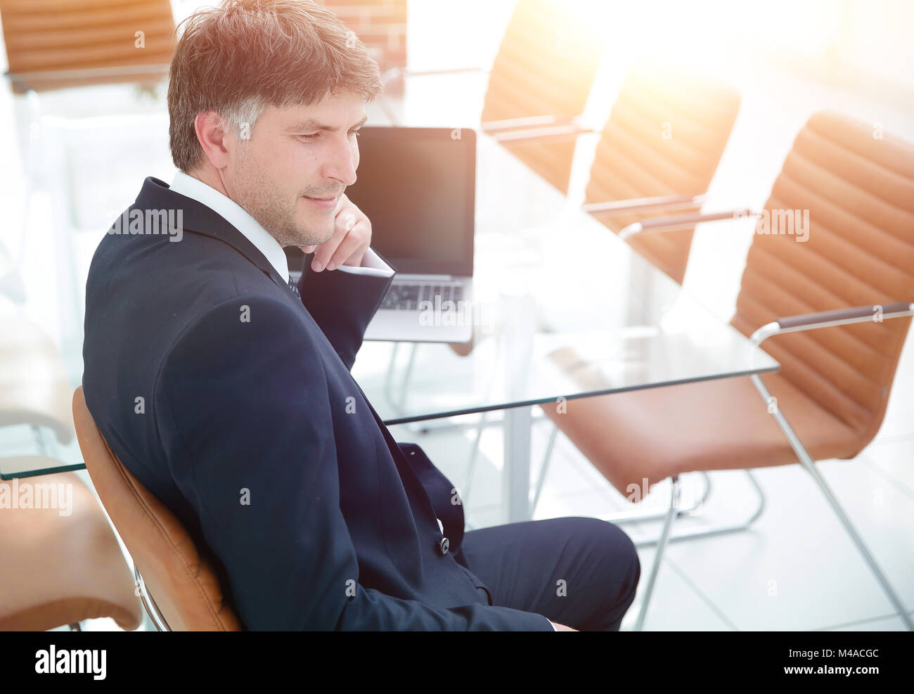 Boss sitting in the workplace before the meeting Stock Photo - Alamy