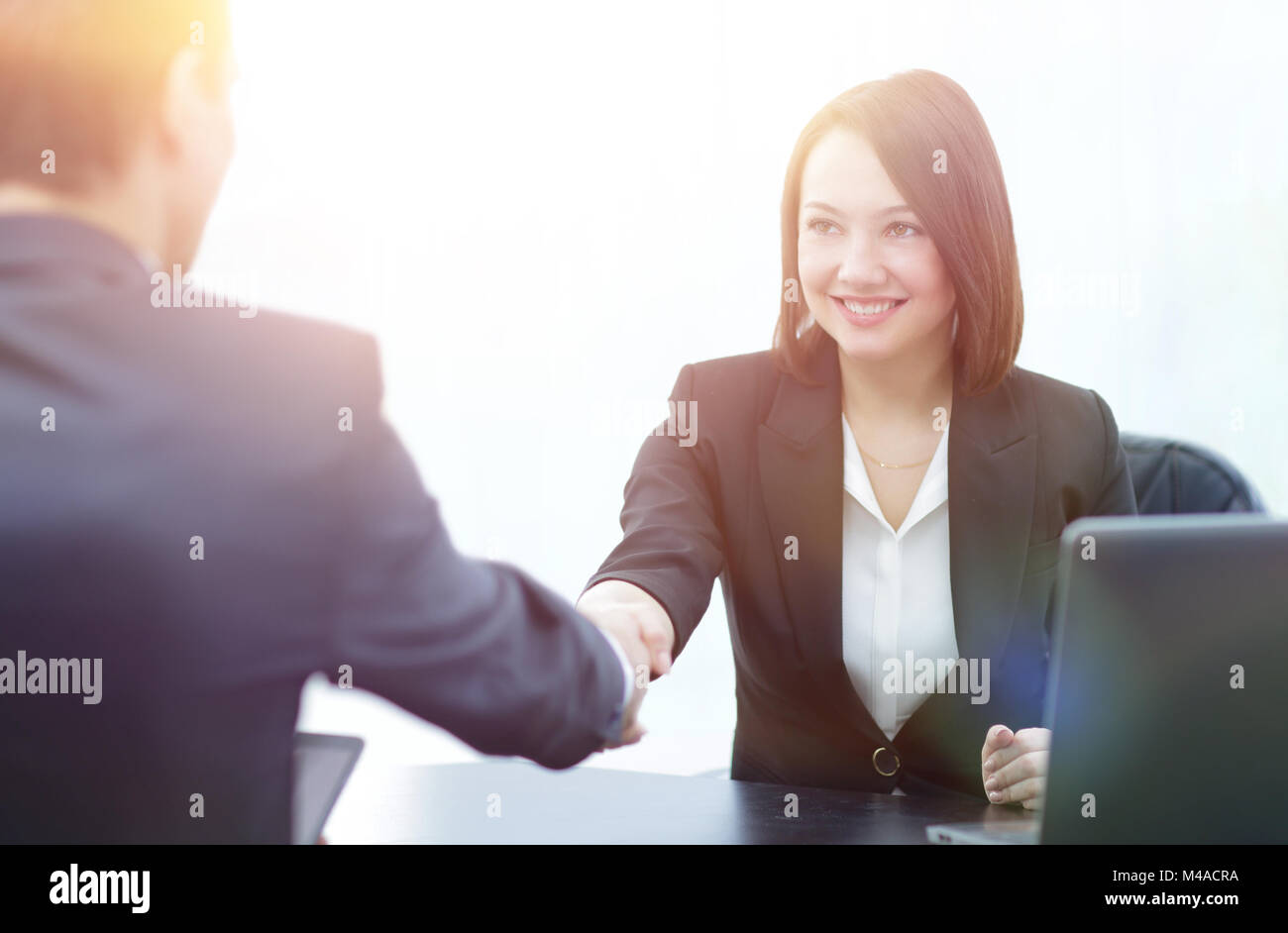 Negotiating business,Image business woman handshake Stock Photo - Alamy