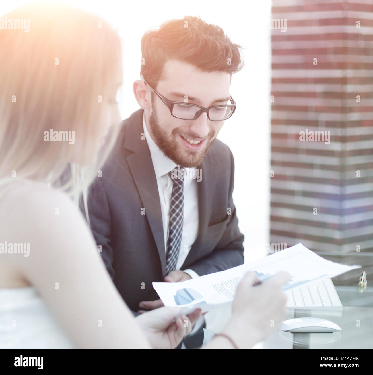 Senior manager and employee discussing financial documents Stock Photo ...