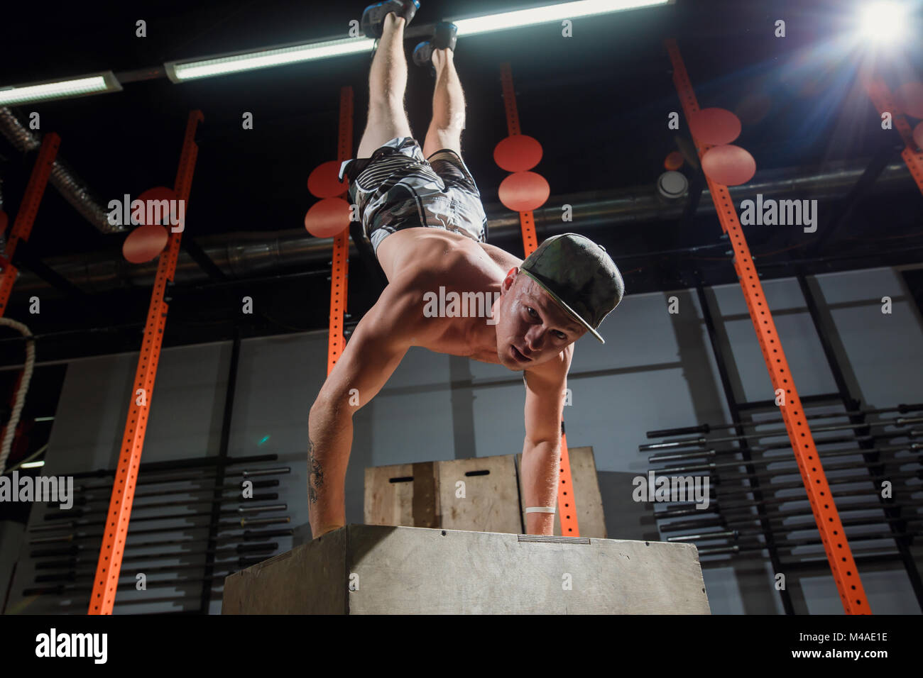 Handstand on box push-up man workout at gym push ups Stock Photo - Alamy