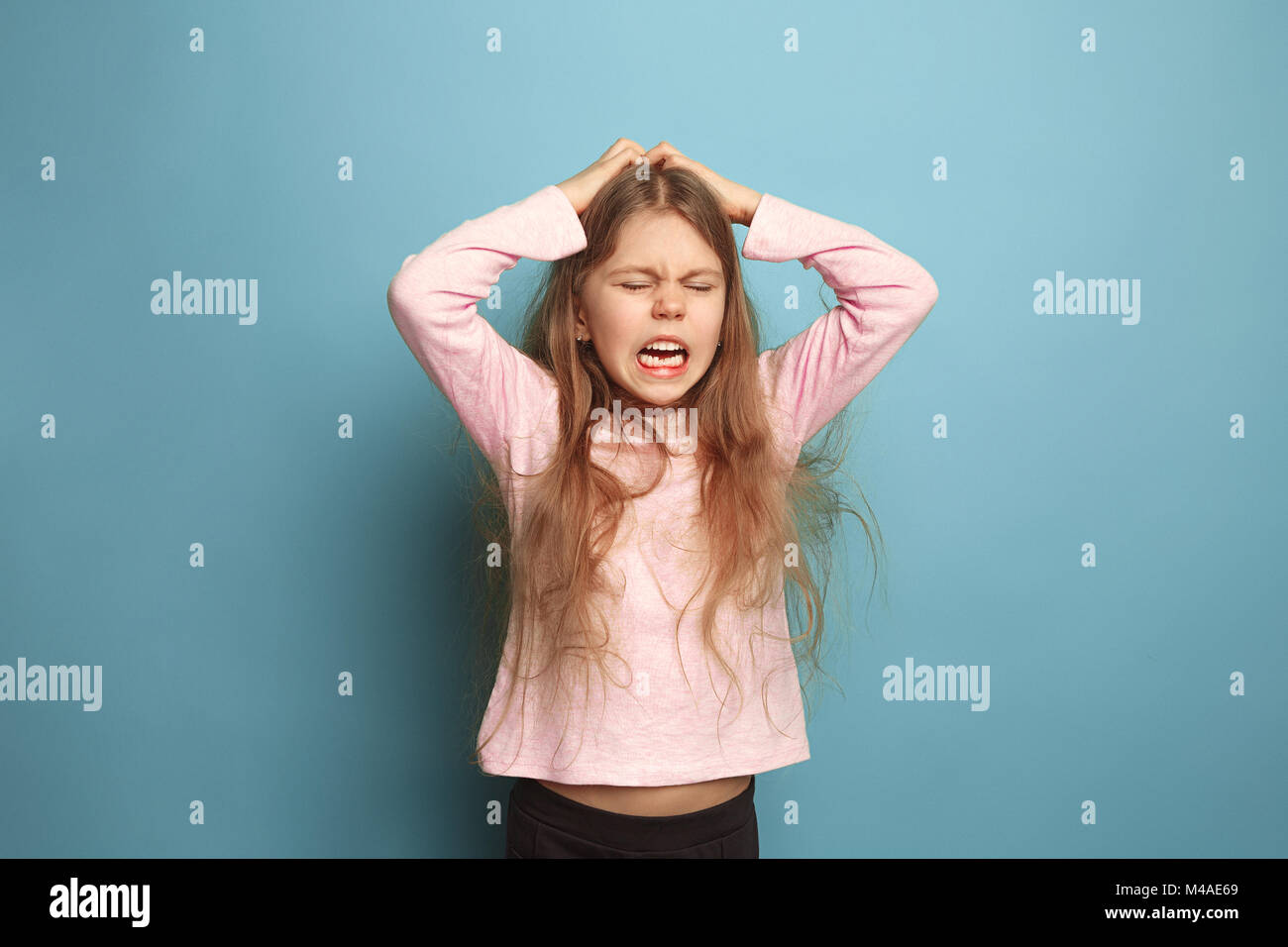 The cry. Teen girl on a blue background. Facial expressions and people ...