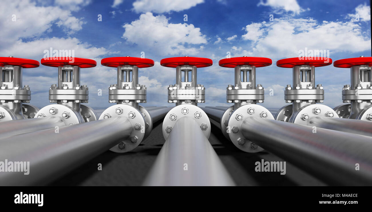 Row of industrial pipelines and valves with red wheels on blue sky ...