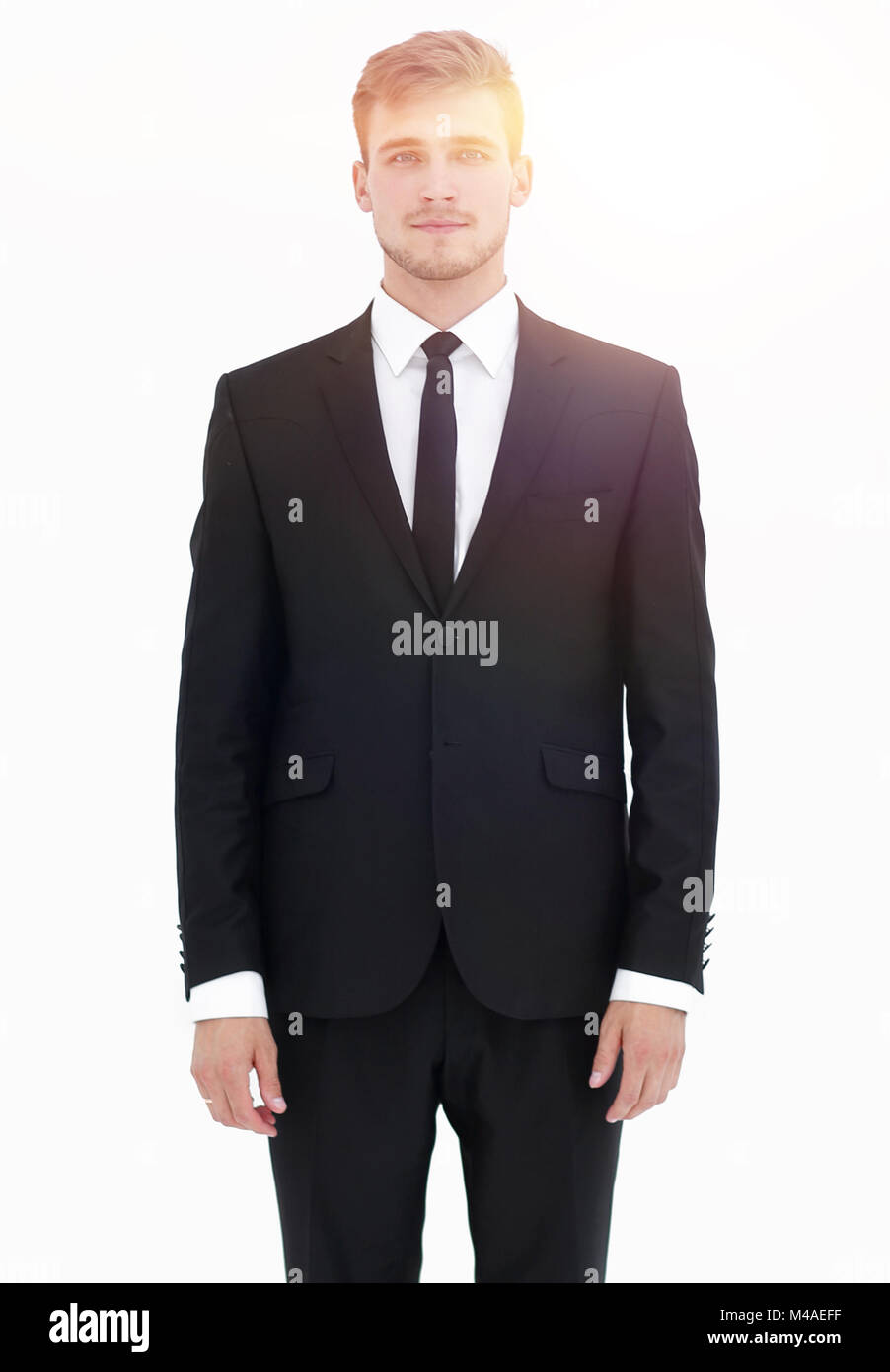 portrait in full length of serious young businessman Stock Photo - Alamy