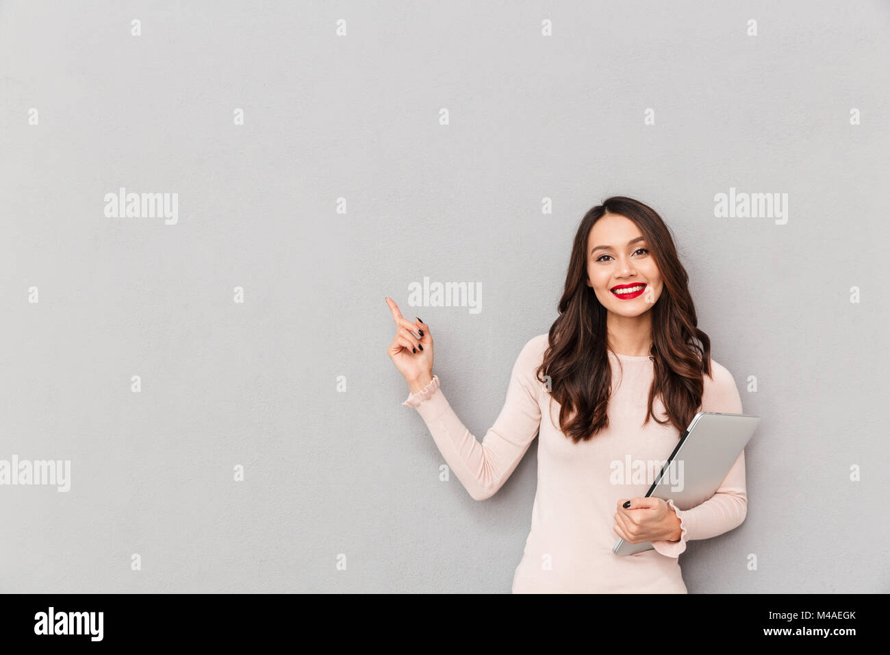 Photo of gorgeous female student studying in college using silver ...
