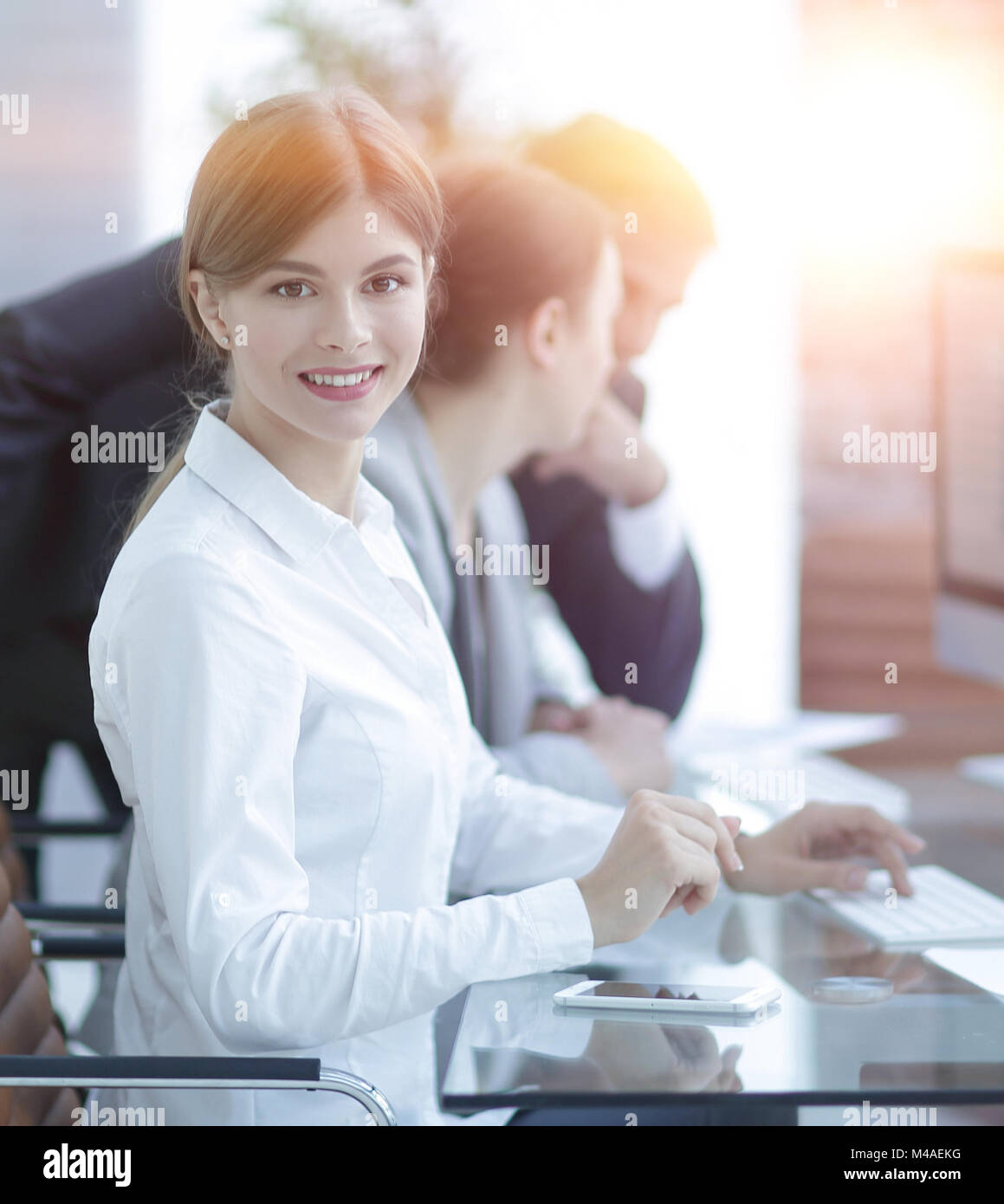 young employee sitting at a Desk Stock Photo - Alamy