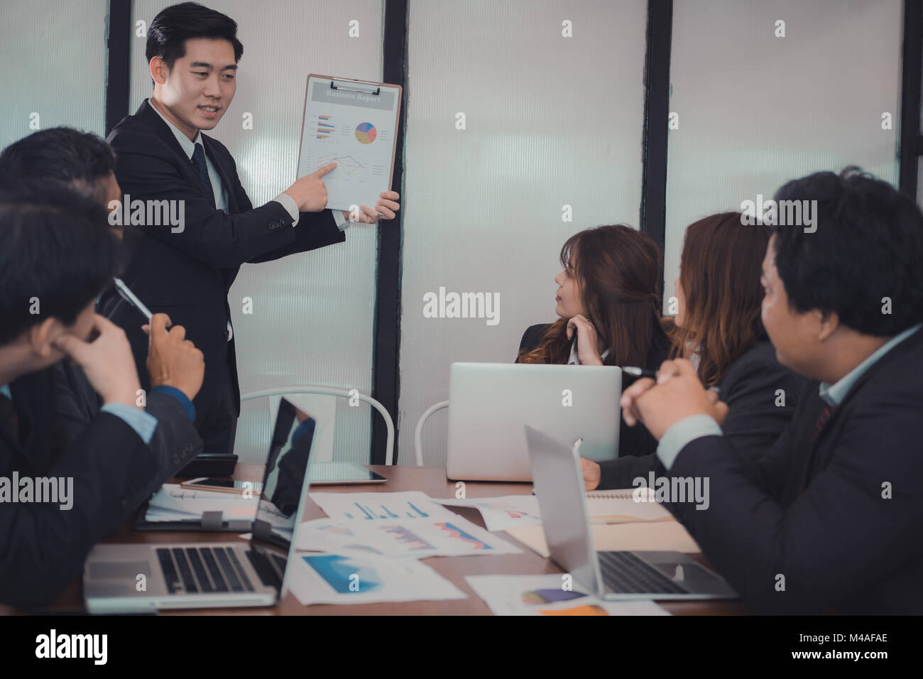 businessman present financial plan report to co worker team. man leader ...