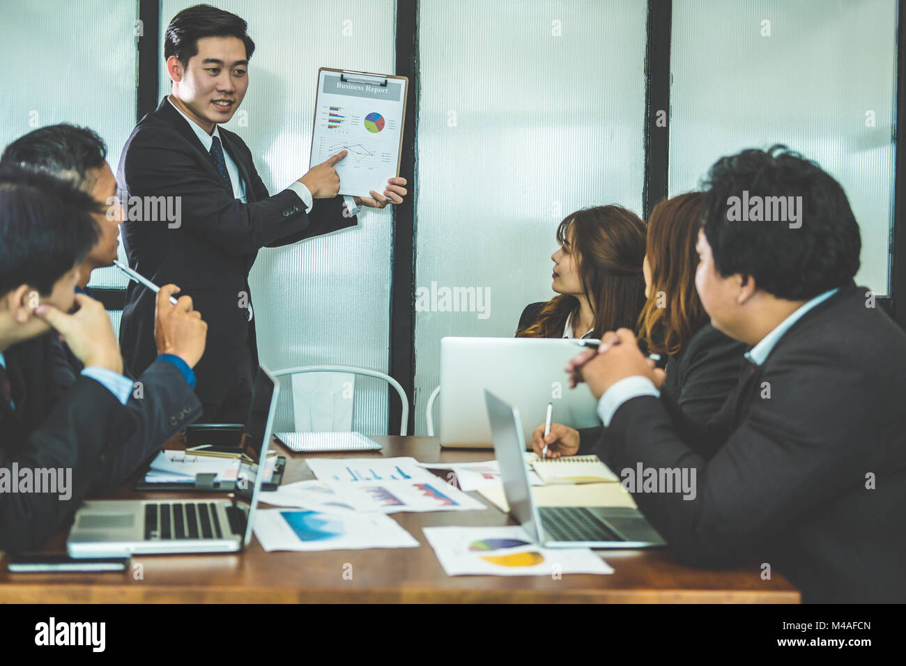 businessman present financial plan report to co worker team. man leader ...