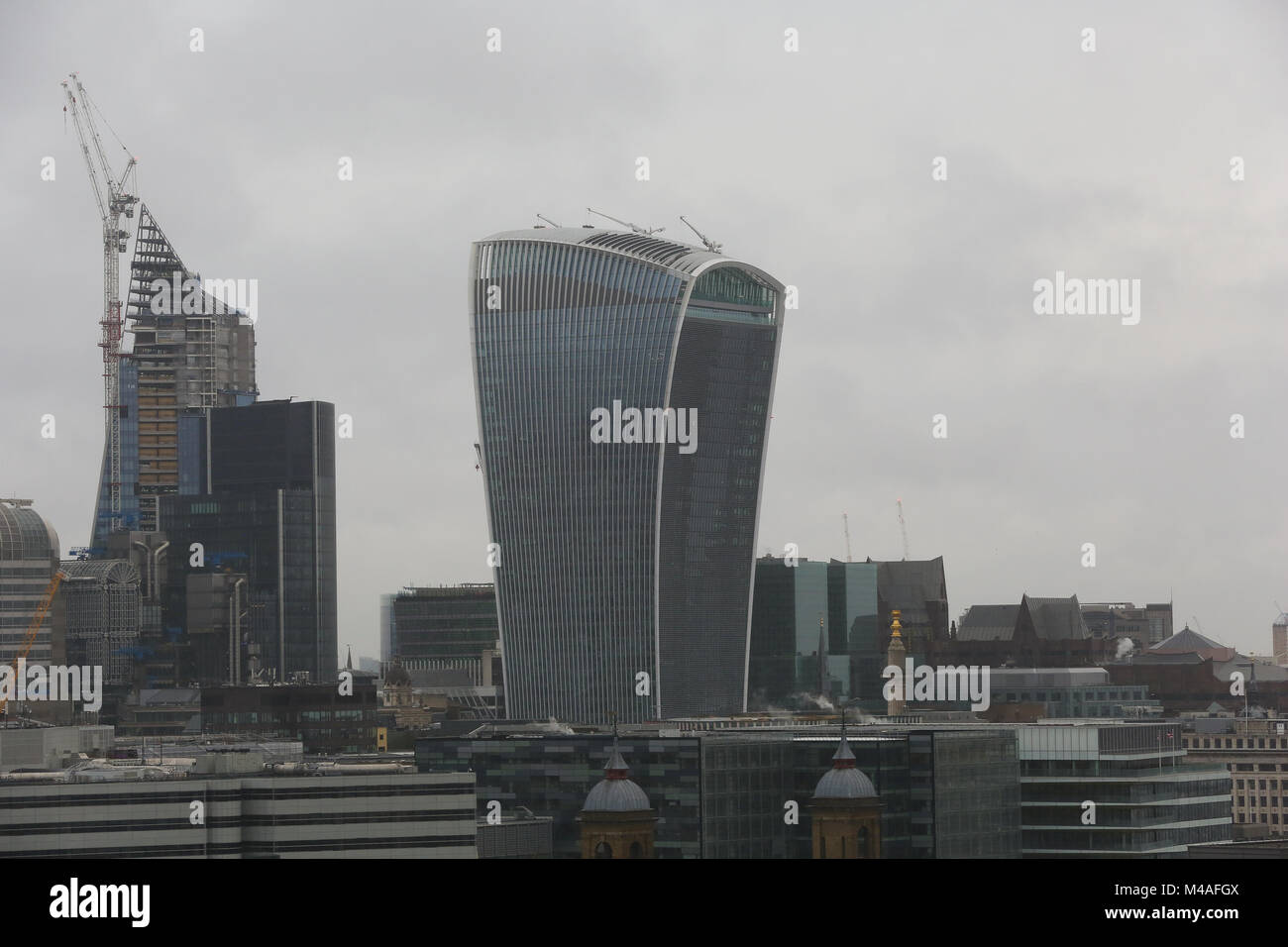 General view of iconic London buildings under a grey sky as heavy rain ...