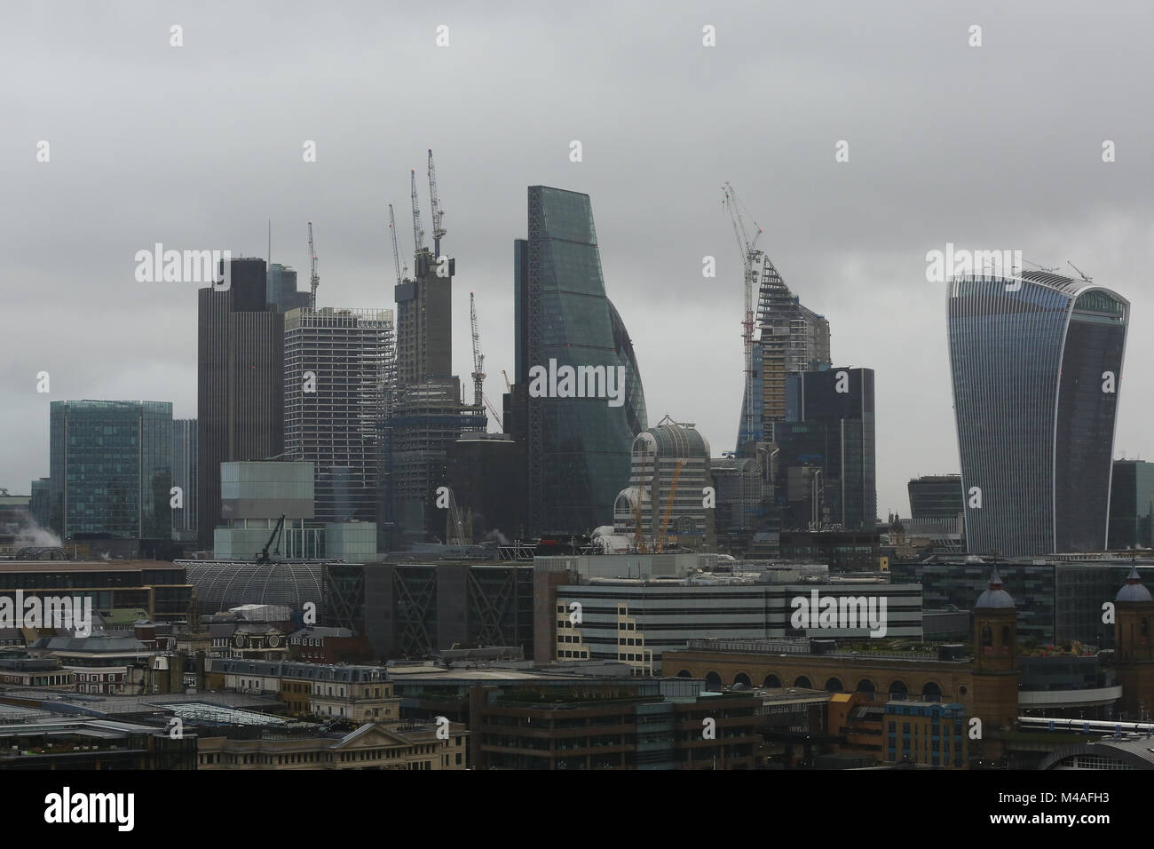 General view of iconic London buildings under a grey sky as heavy rain ...