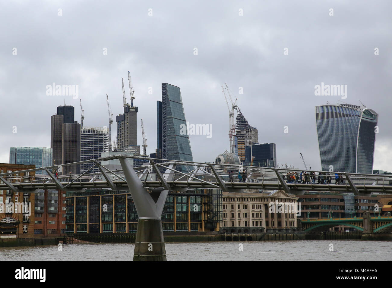 General view of iconic London buildings under a grey sky as heavy rain ...