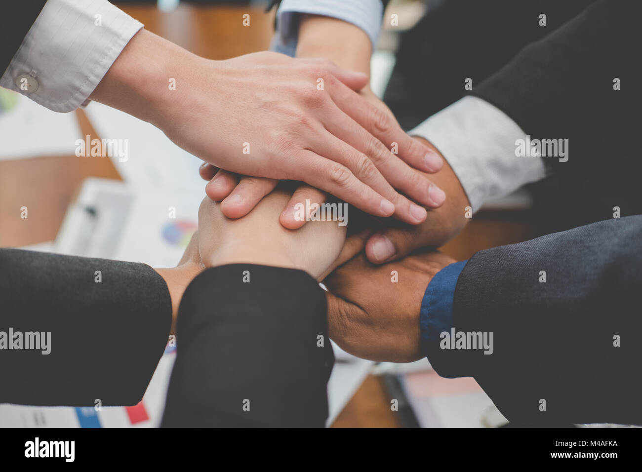 businessman joining united hand, business team touching hands together ...