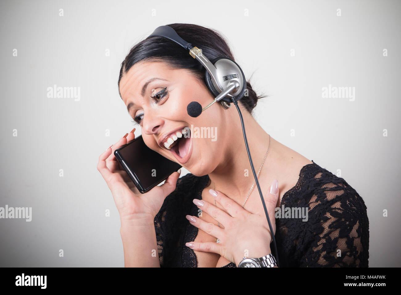 Cheerful customer service agent, telemarketing lady Stock Photo - Alamy