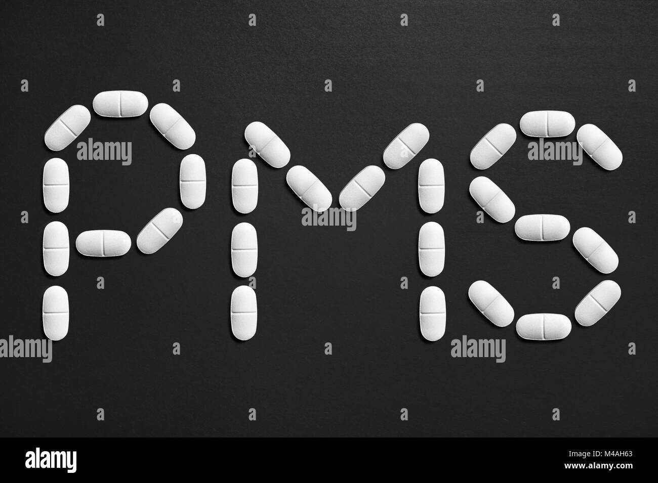 PMS text made from pills. Menstruation and having period concept Stock ...