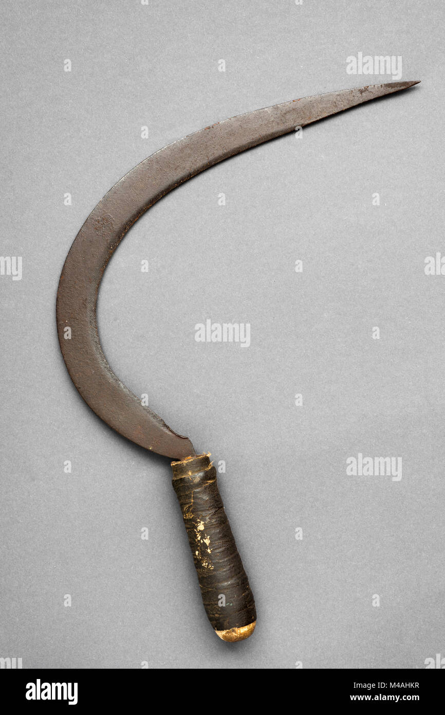 vintage rusty sickle isolated on gray background Stock Photo - Alamy