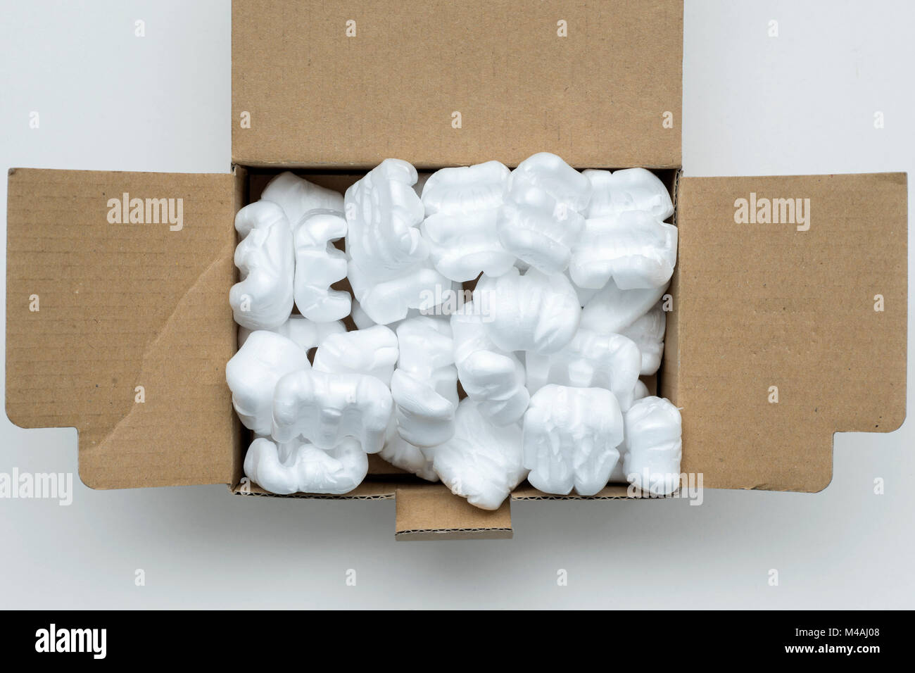white filling package pieces inside open carton container Stock Photo ...