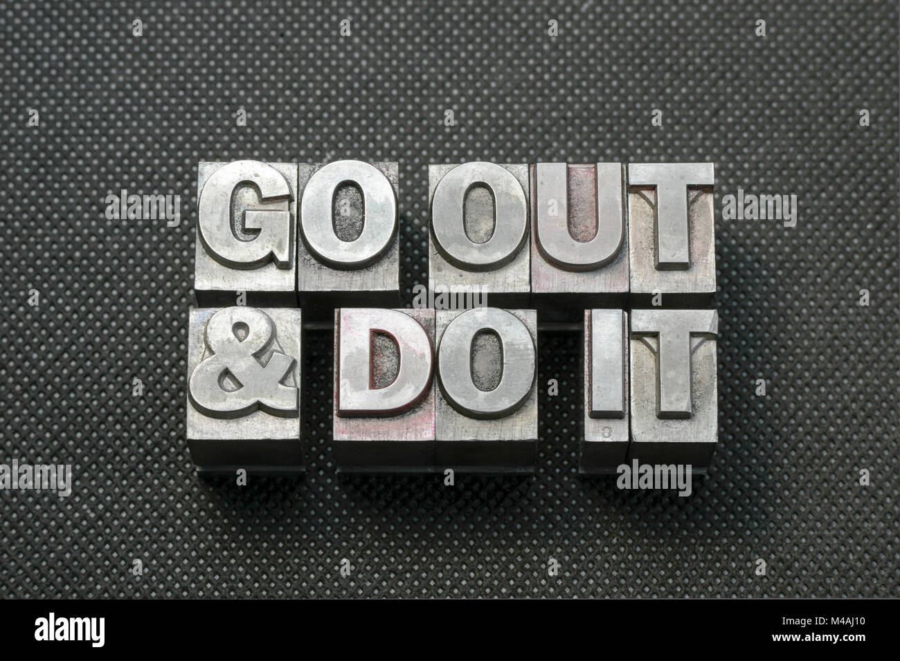 go out and do it made from metallic letterpress blocks on black ...