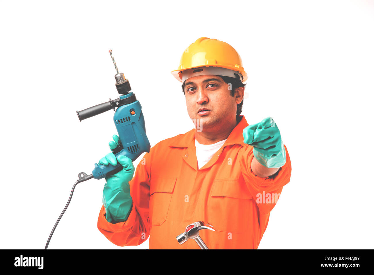 Indian electrician engineer in action with wire cutter, drilling ...