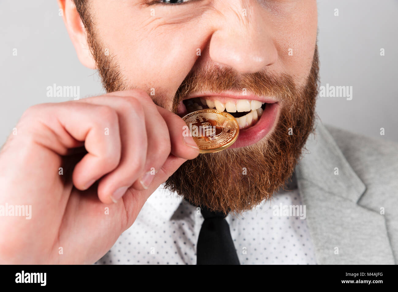 Biting Gold Coin High Resolution Stock Photography and Images - Alamy