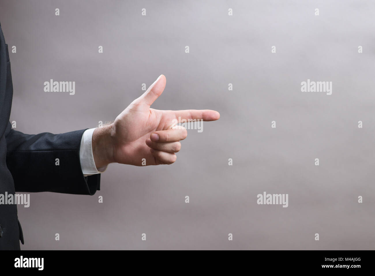 Hand of a business person points the index finger Stock Photo - Alamy