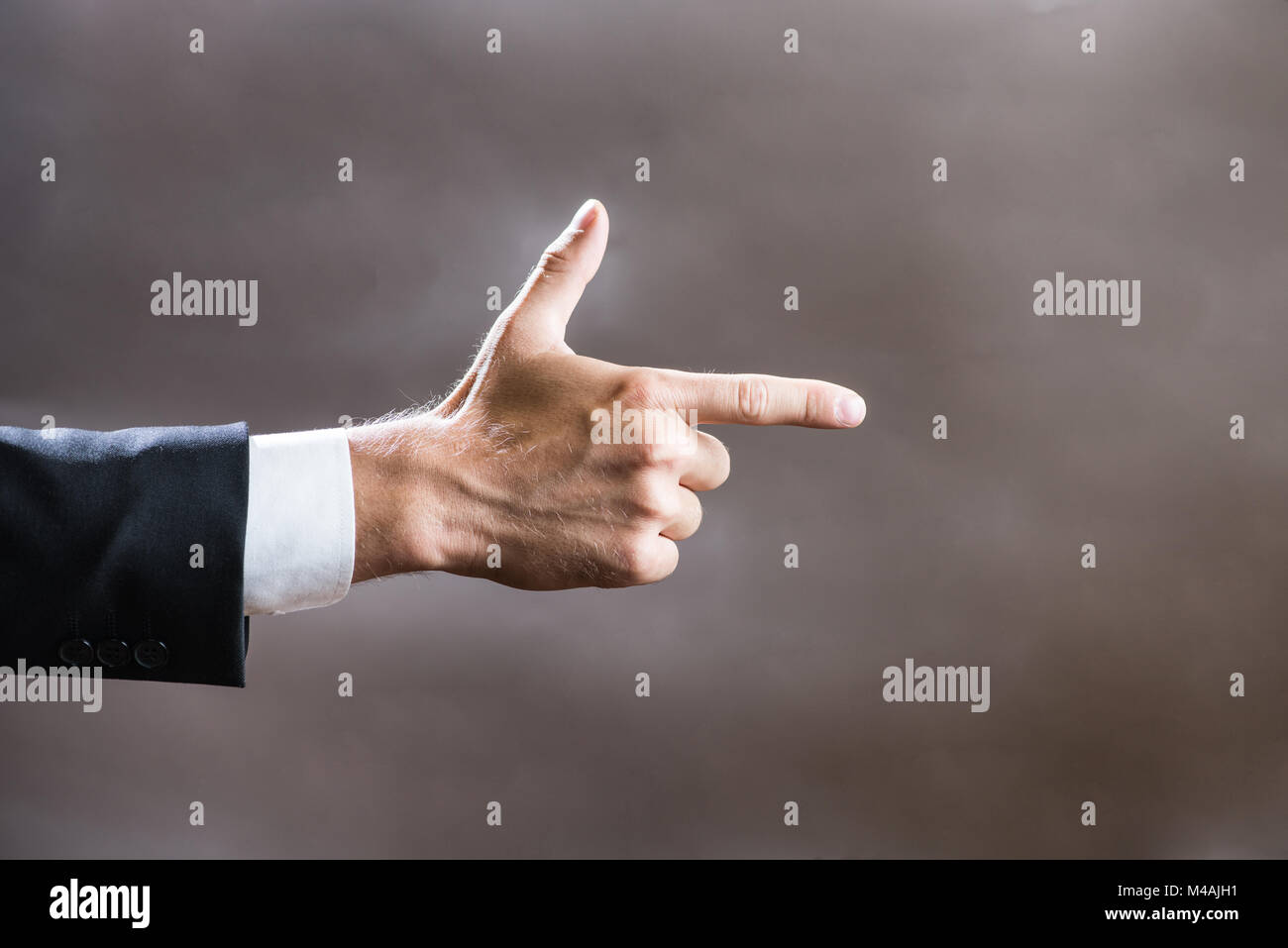 Hand of a business person points the index finger Stock Photo - Alamy