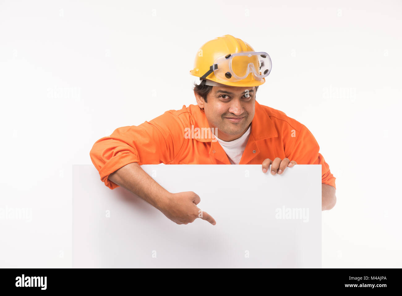 Indian electrician engineer in action with wire cutter, drilling ...