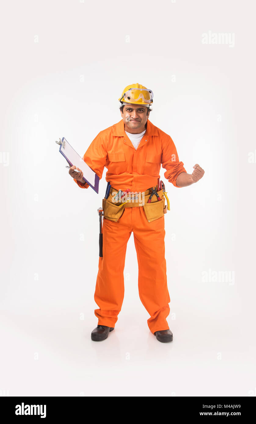 Indian electrician engineer in action with wire cutter, drilling ...