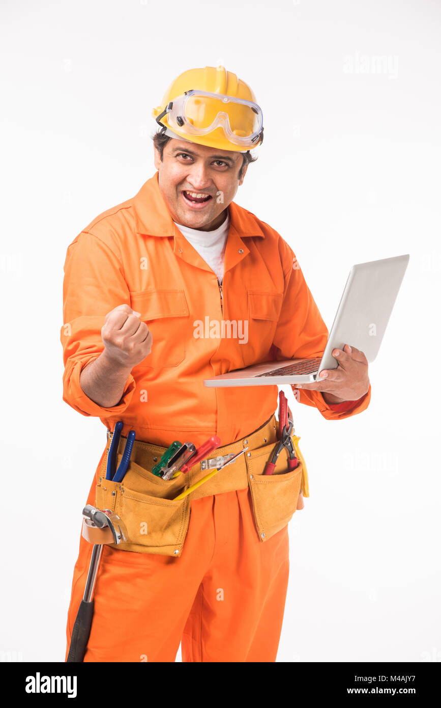 Indian electrician engineer in action with wire cutter, drilling ...