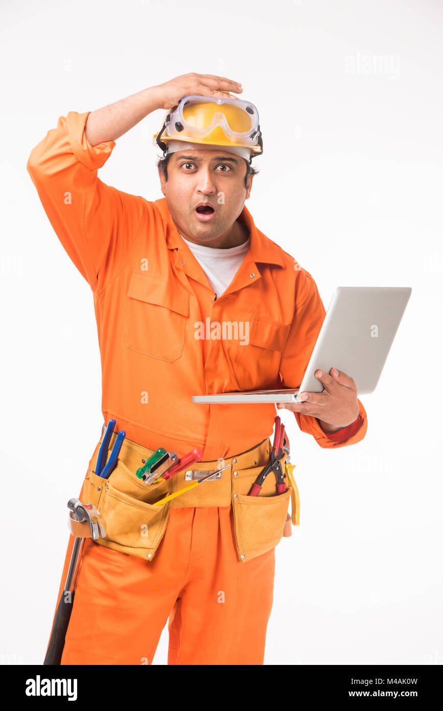 Indian electrician engineer in action with wire cutter, drilling ...