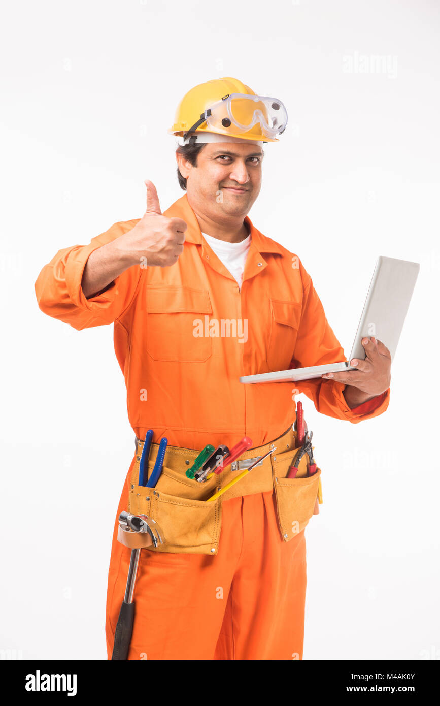 Indian electrician engineer in action with wire cutter, drilling ...