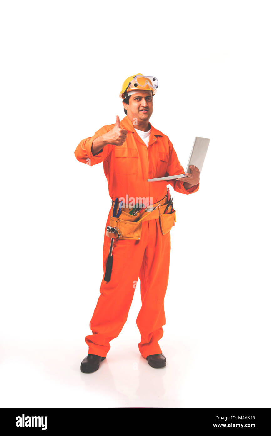 Indian electrician engineer in action with wire cutter, drilling ...