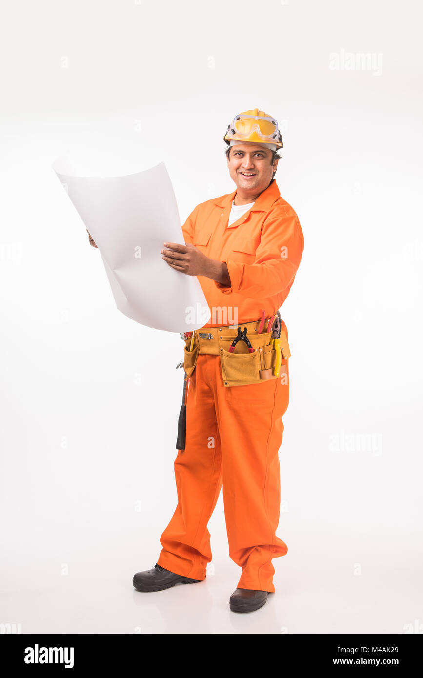 Indian electrician engineer in action with wire cutter, drilling ...