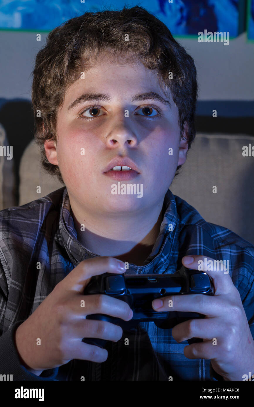 boy with joystick playing computer game at home Stock Photo - Alamy