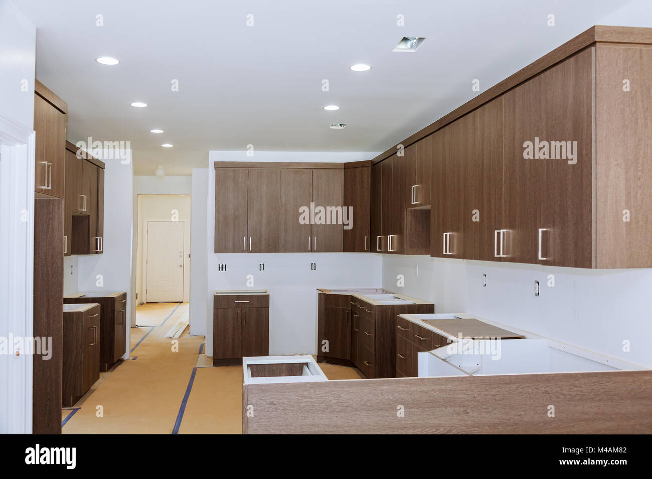 Custom kitchen cabinets in various stages of installation base for ...