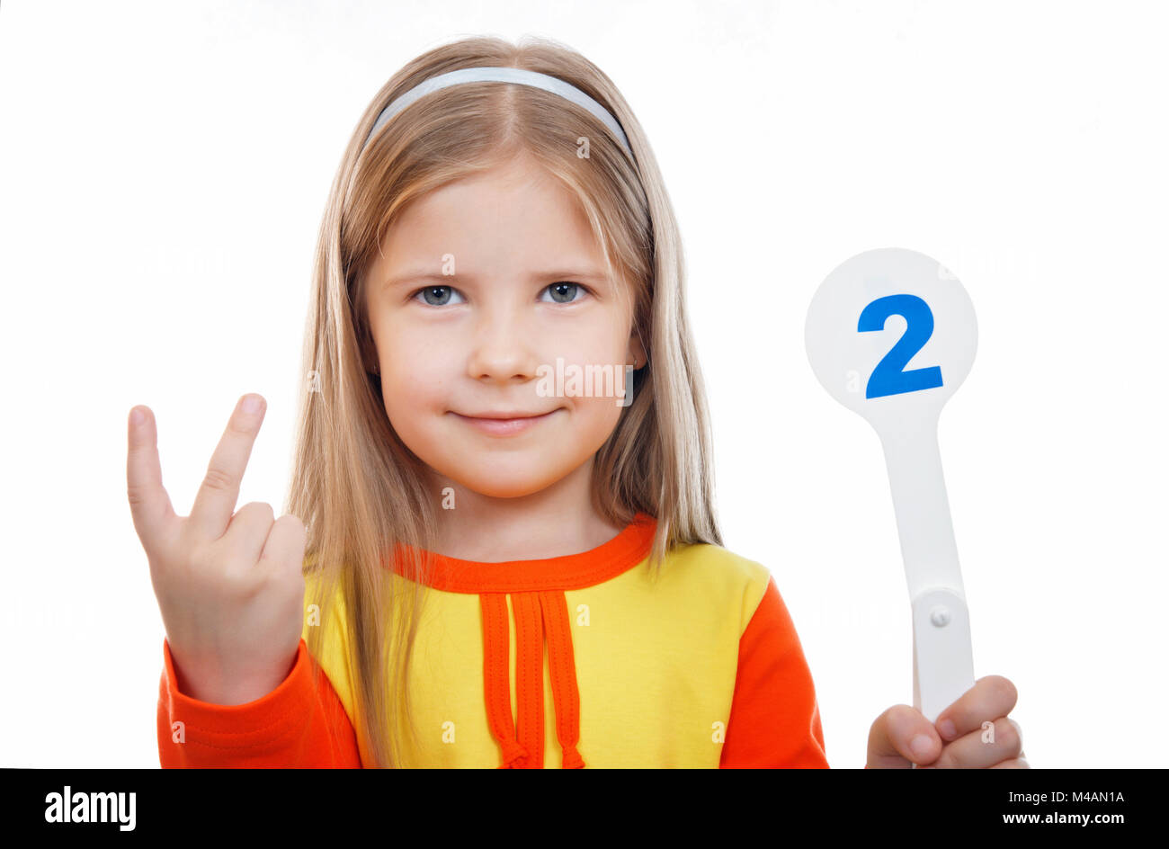 A preschool girl is learning numerals and numeracy. Shows the figure ...