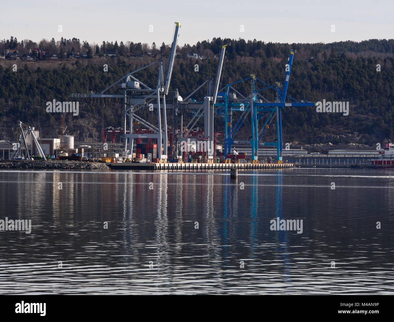 Four massive loading cranes in the international port in Oslo Norway ...