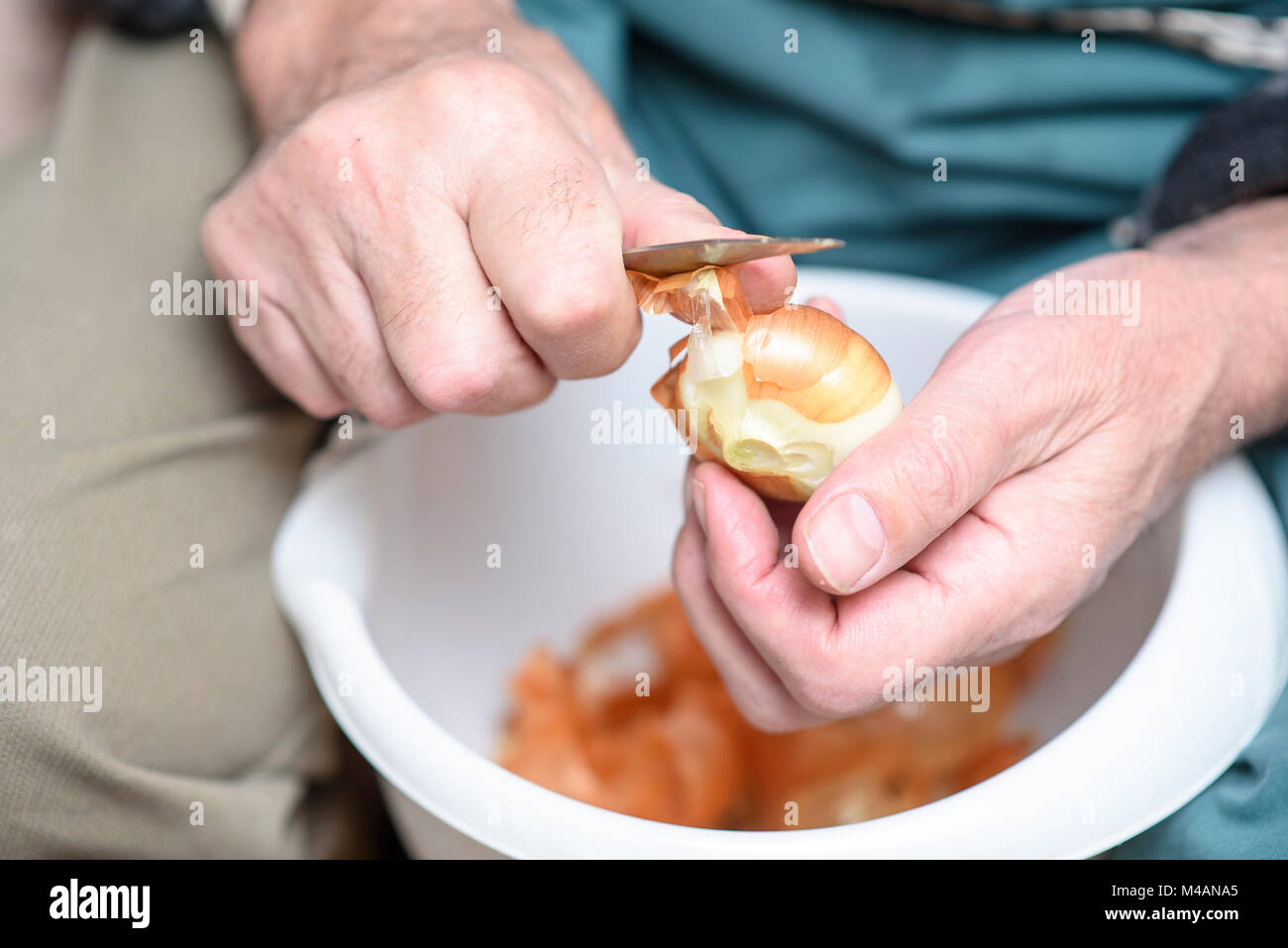 Peeling the onion hi-res stock photography and images - Alamy