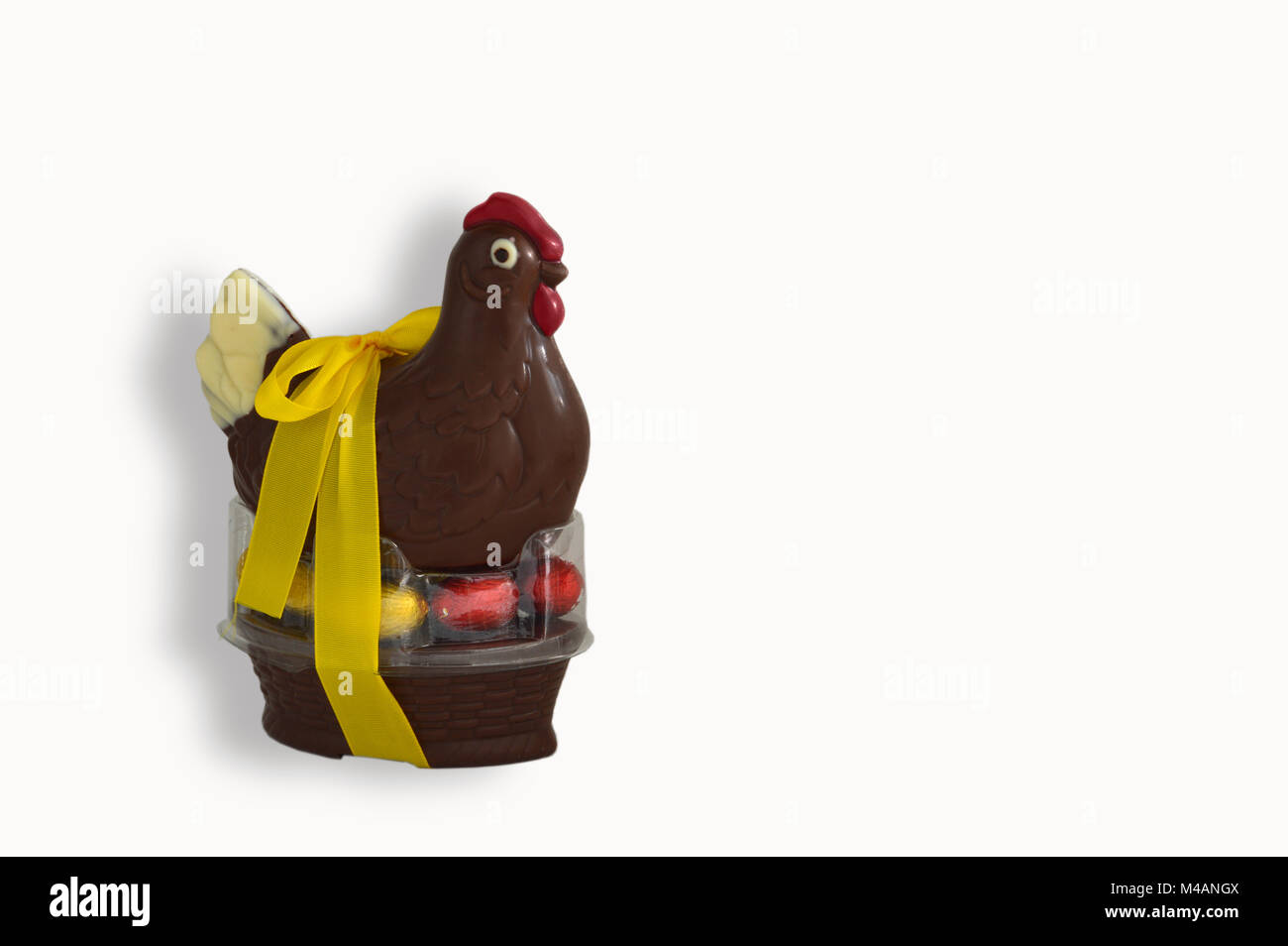 chocolate hen with eggs on white background Stock Photo - Alamy