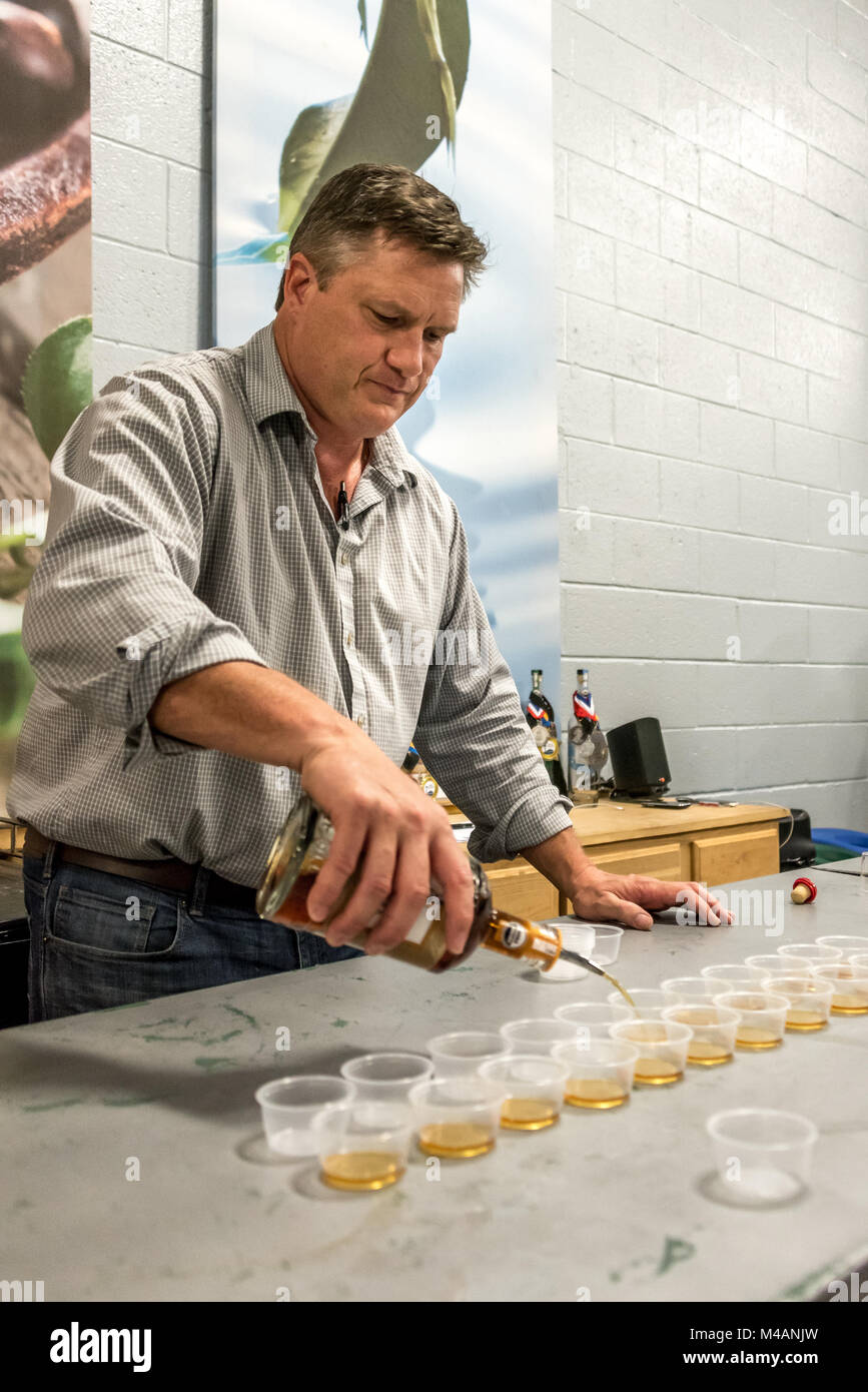 Chapel Hill Topo Distillery proprietor Scott Maitland pours vodka ...