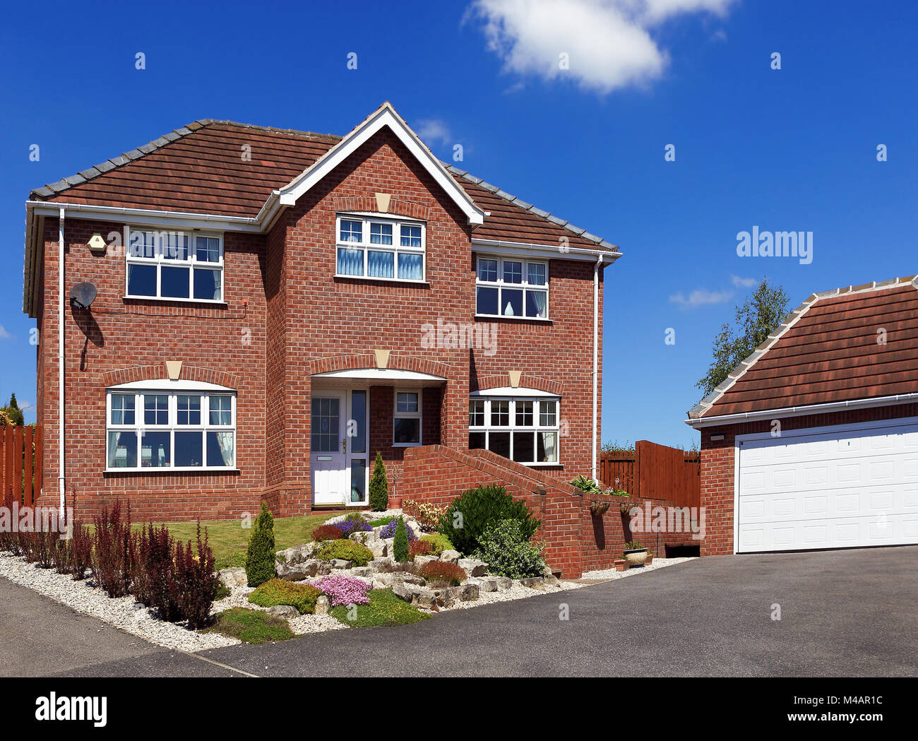 Elegant english house with garage Stock Photo - Alamy