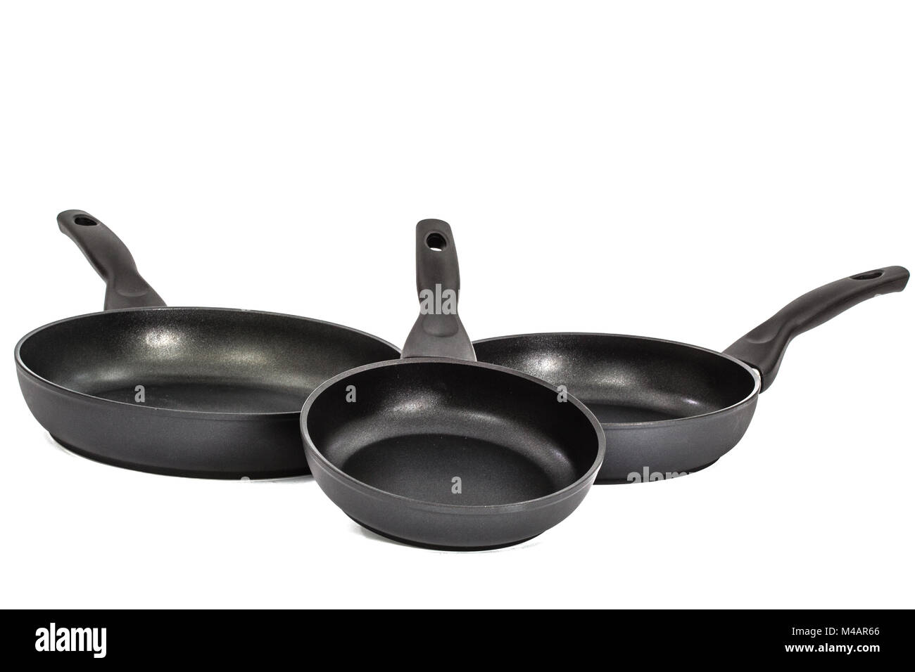 Three frying pans, isolated on white background Stock Photo - Alamy
