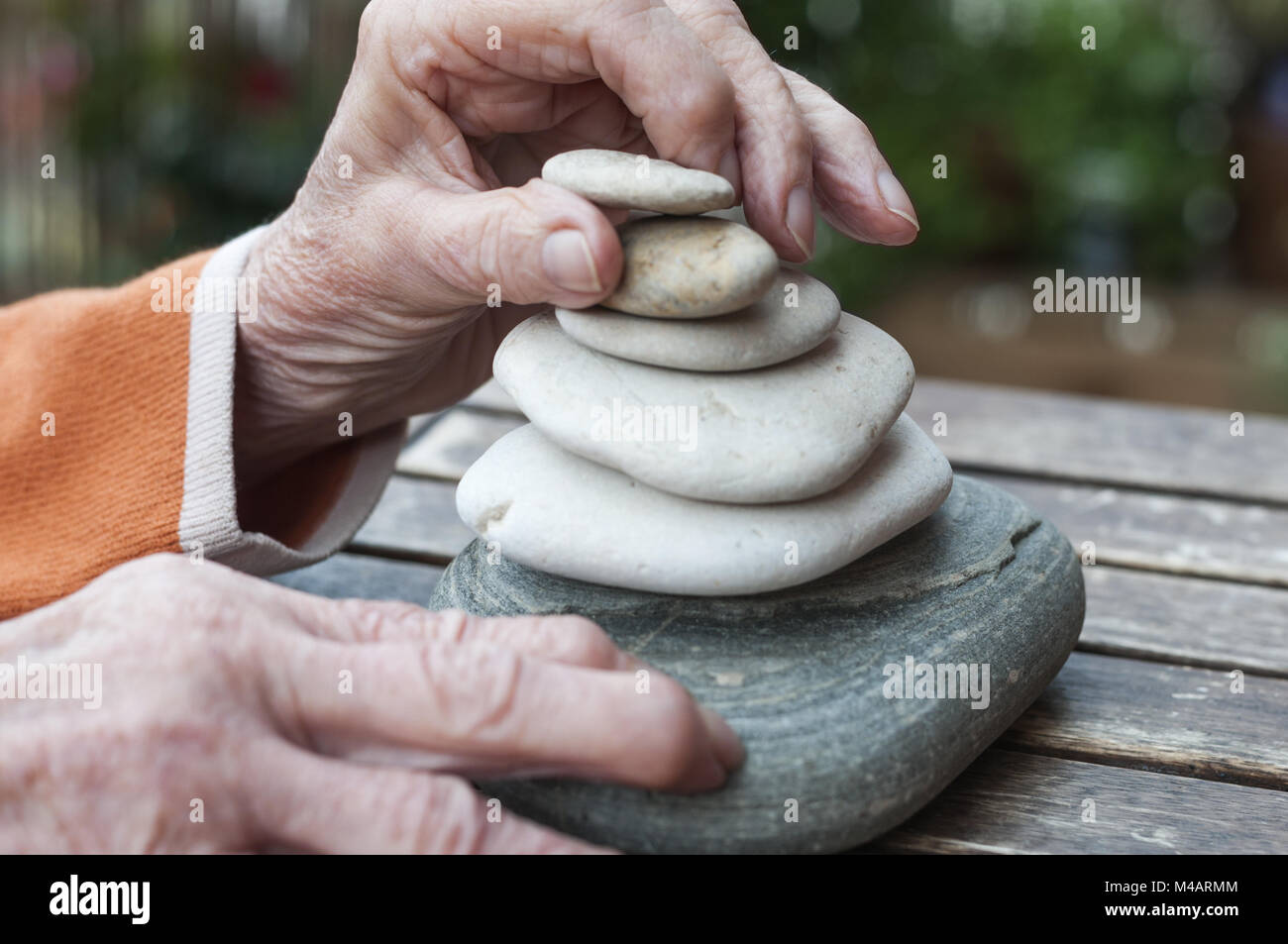 Building a cairn Stock Photo - Alamy