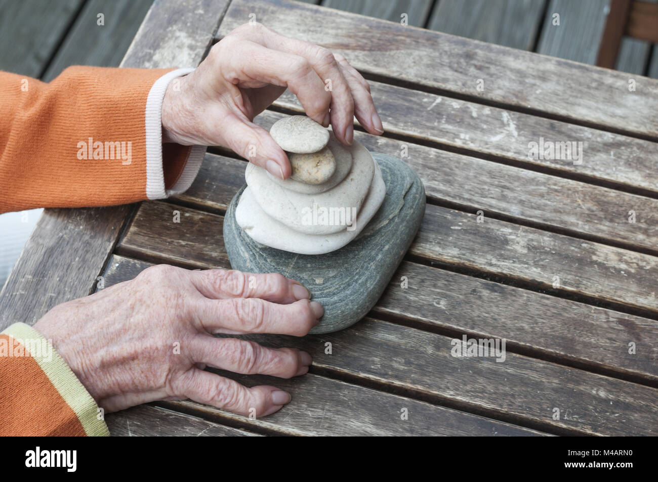 Building a cairn Stock Photo - Alamy