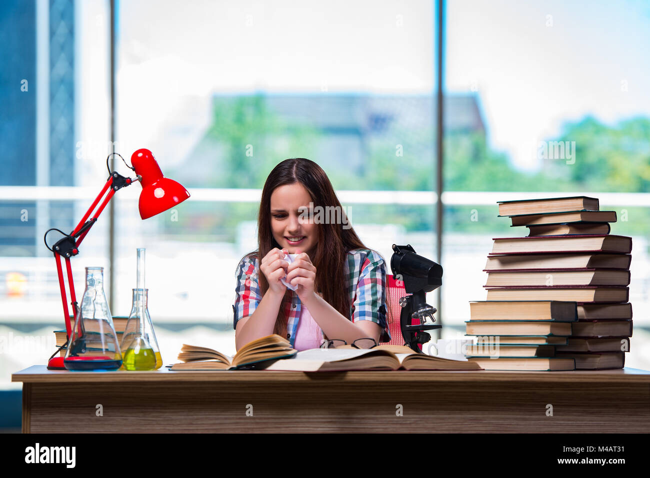 The sad student preparing for chemistry exams Stock Photo - Alamy