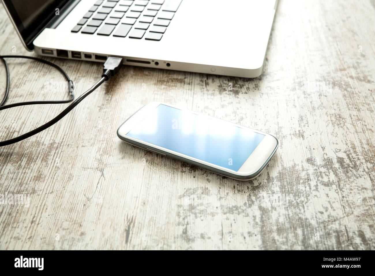Smartphone and a Laptop computer on a Desktop Stock Photo - Alamy
