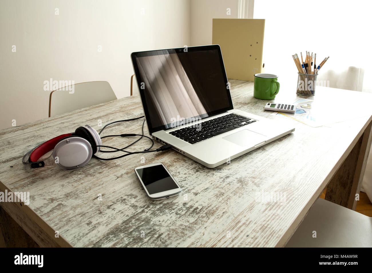 Electronics and a Laptop computer on a Desktop Stock Photo - Alamy