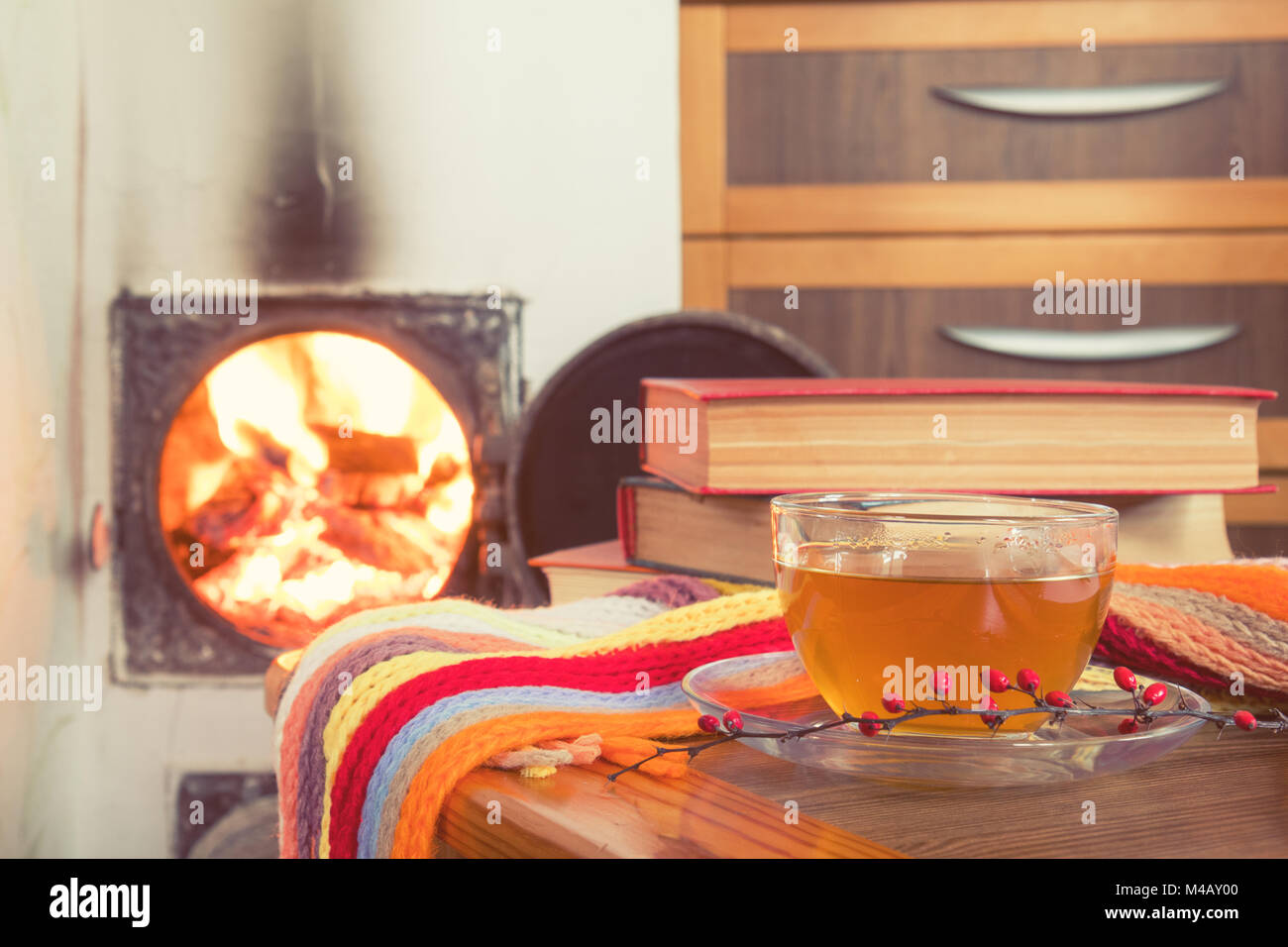 Cup of tea and flames of fire in a fireplace Stock Photo - Alamy